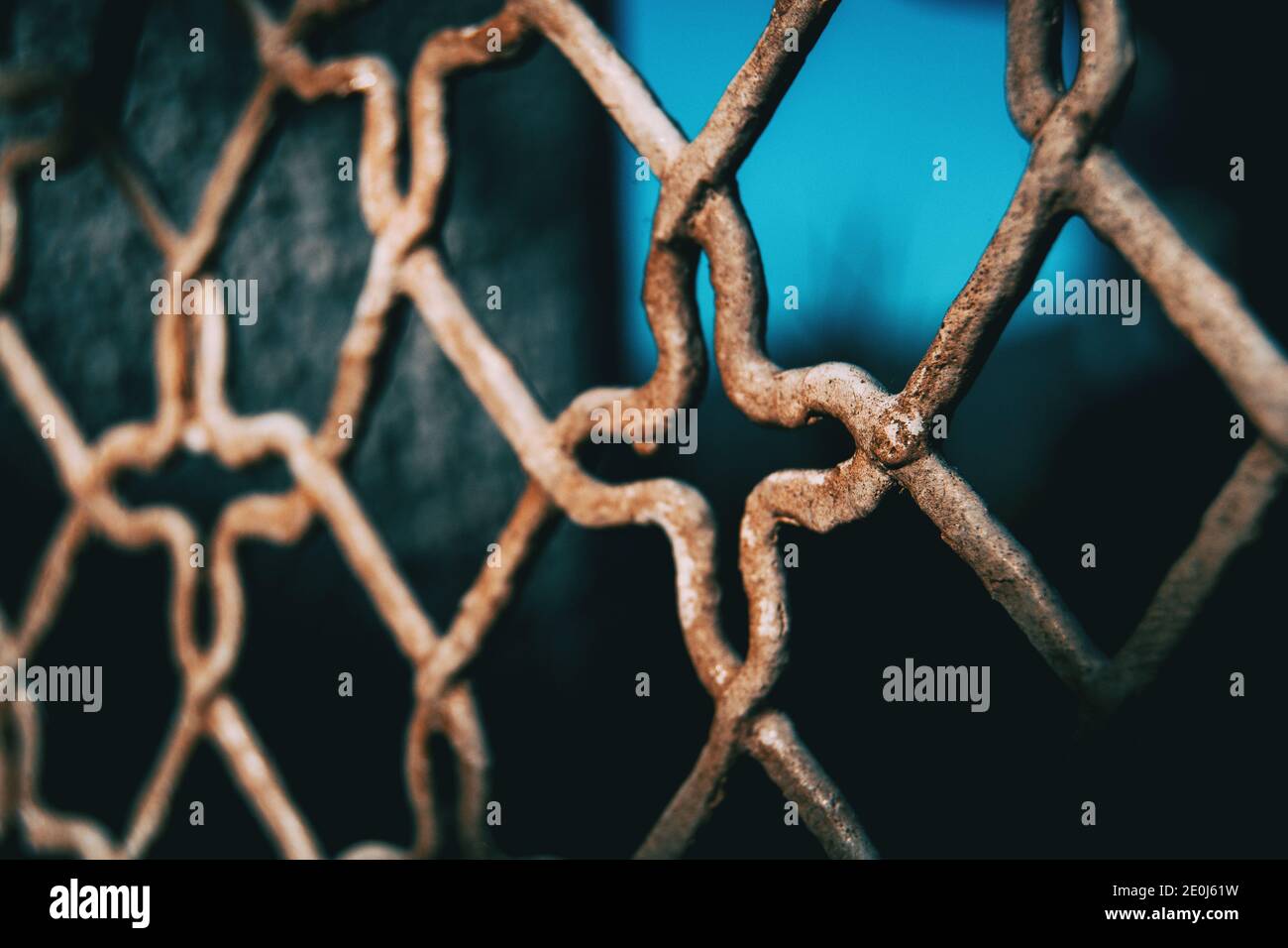 window with a rusty grille with a wrought iron pattern Stock Photo - Alamy