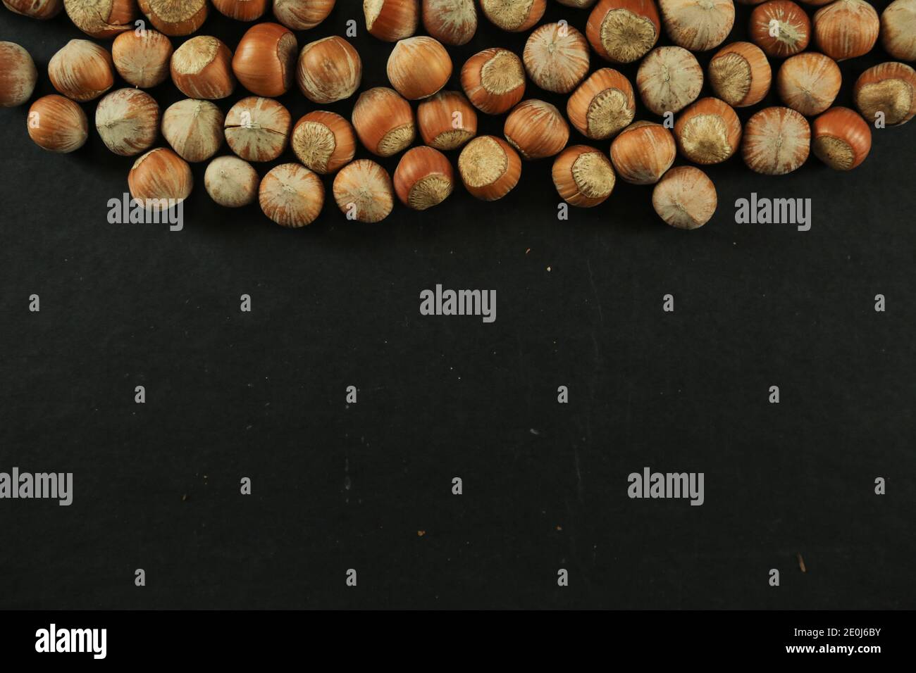 Hazelnuts on wooden backdrop. heap or stack of hazelnuts. healty food ...