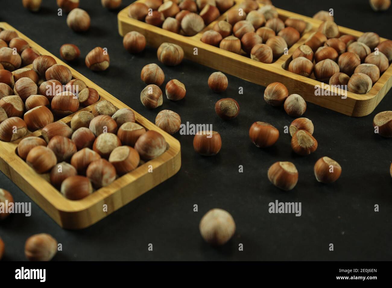 Hazelnuts on wooden backdrop. heap or stack of hazelnuts. healty food ...