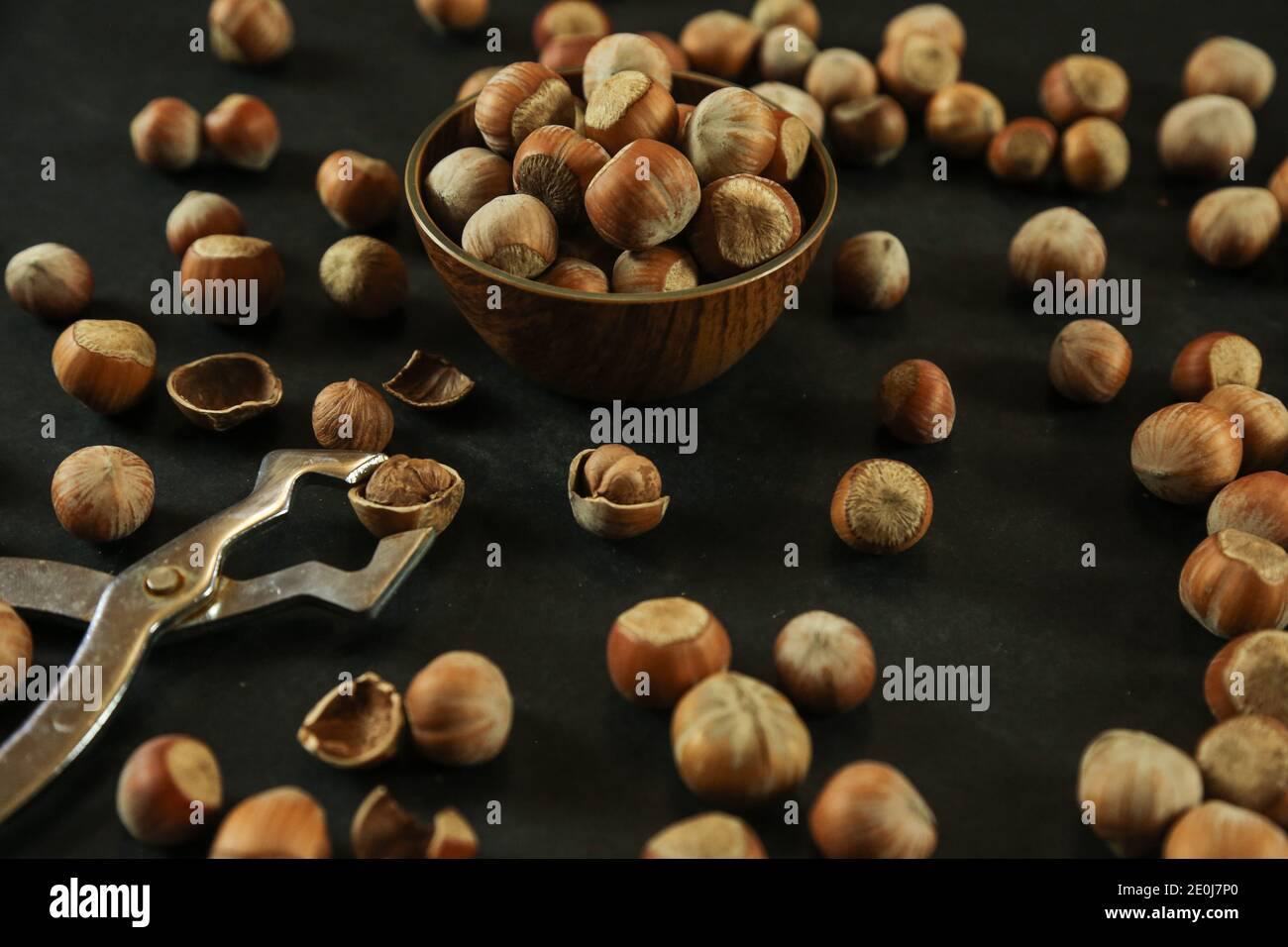 Hazelnuts on wooden backdrop. heap or stack of hazelnuts. healty food ...