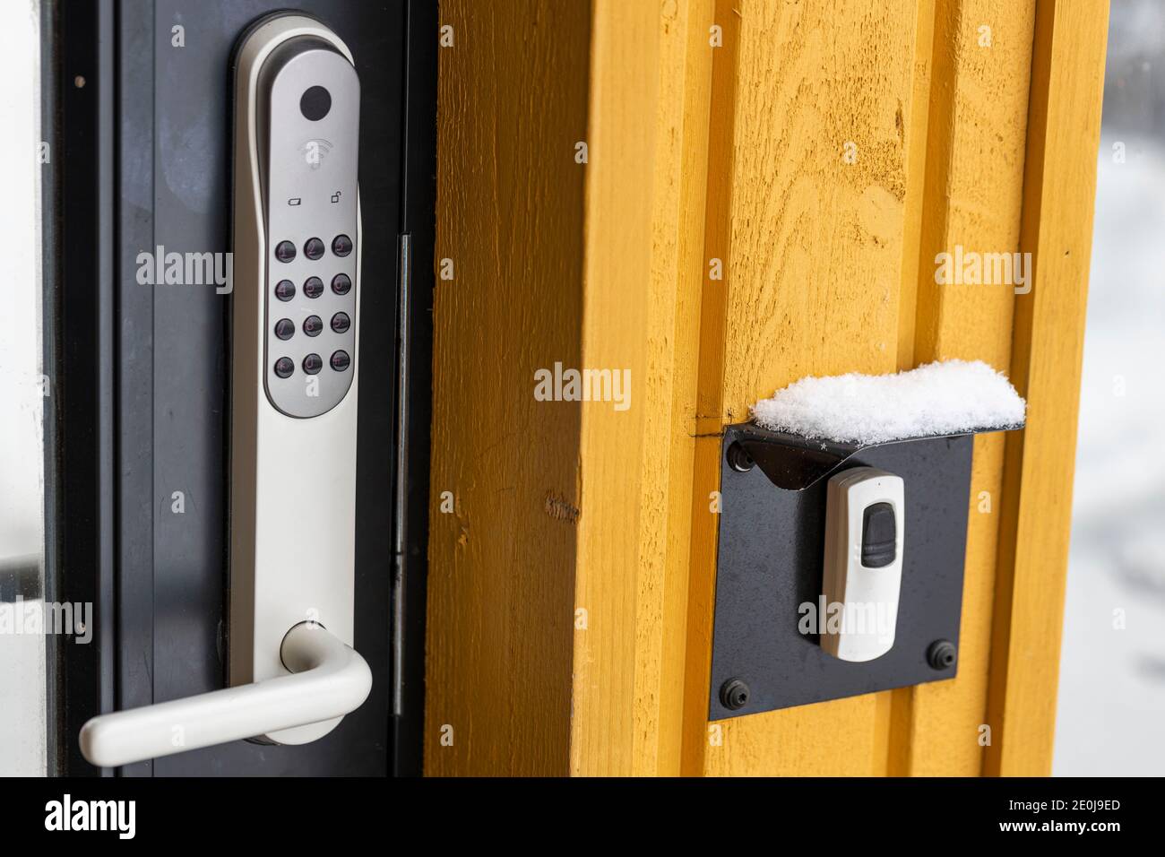 Close up view of an electric combination lock on a black door. Interior ...