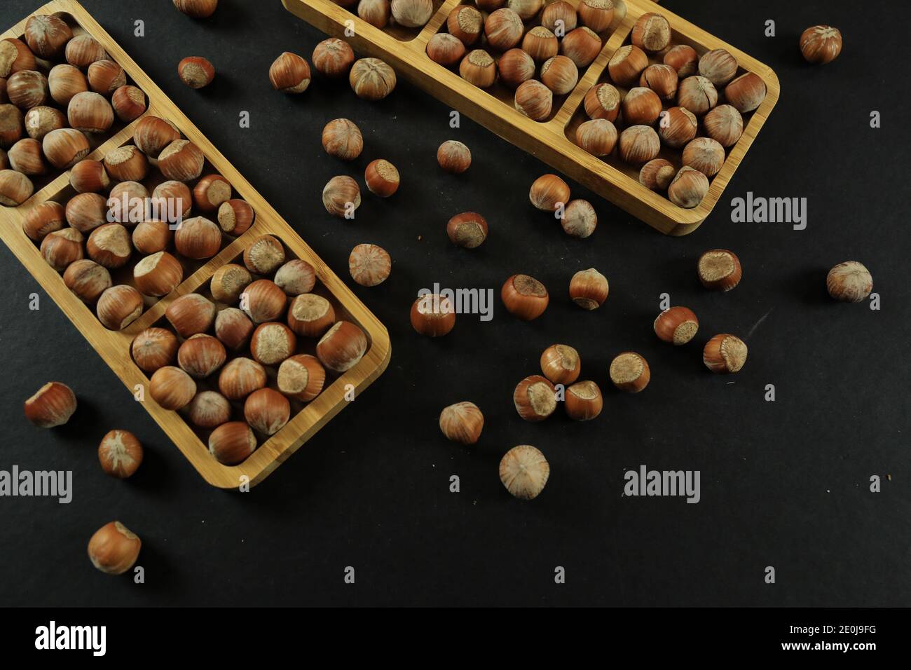 Hazelnuts on wooden backdrop. heap or stack of hazelnuts. healty food ...