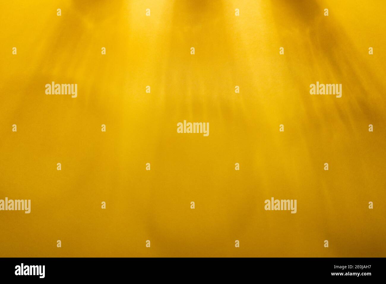 Abstract yellow background with blurred glass shadows. Smooth, soft ...