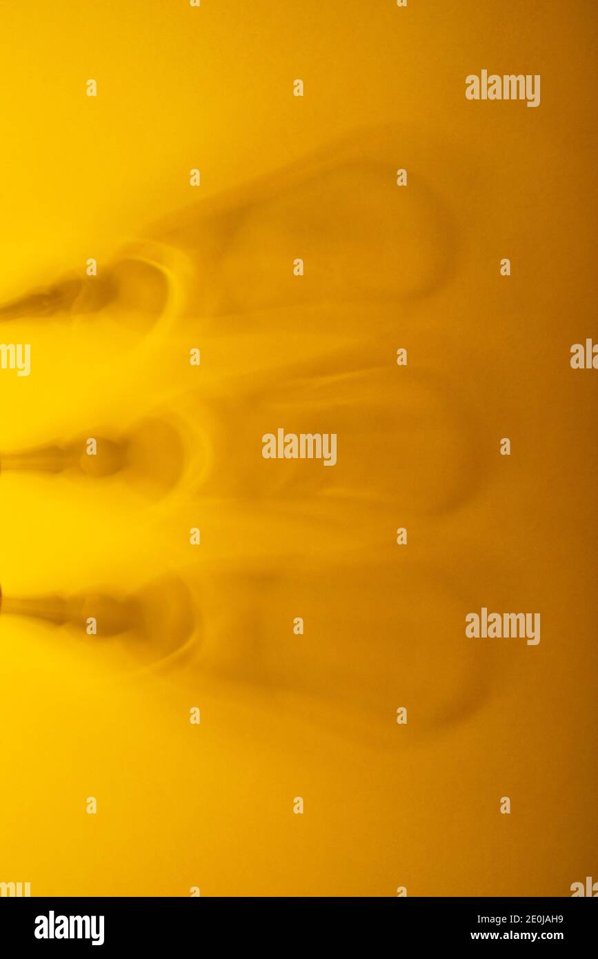 Abstract yellow background with blurred glass shadows. Smooth, soft ...