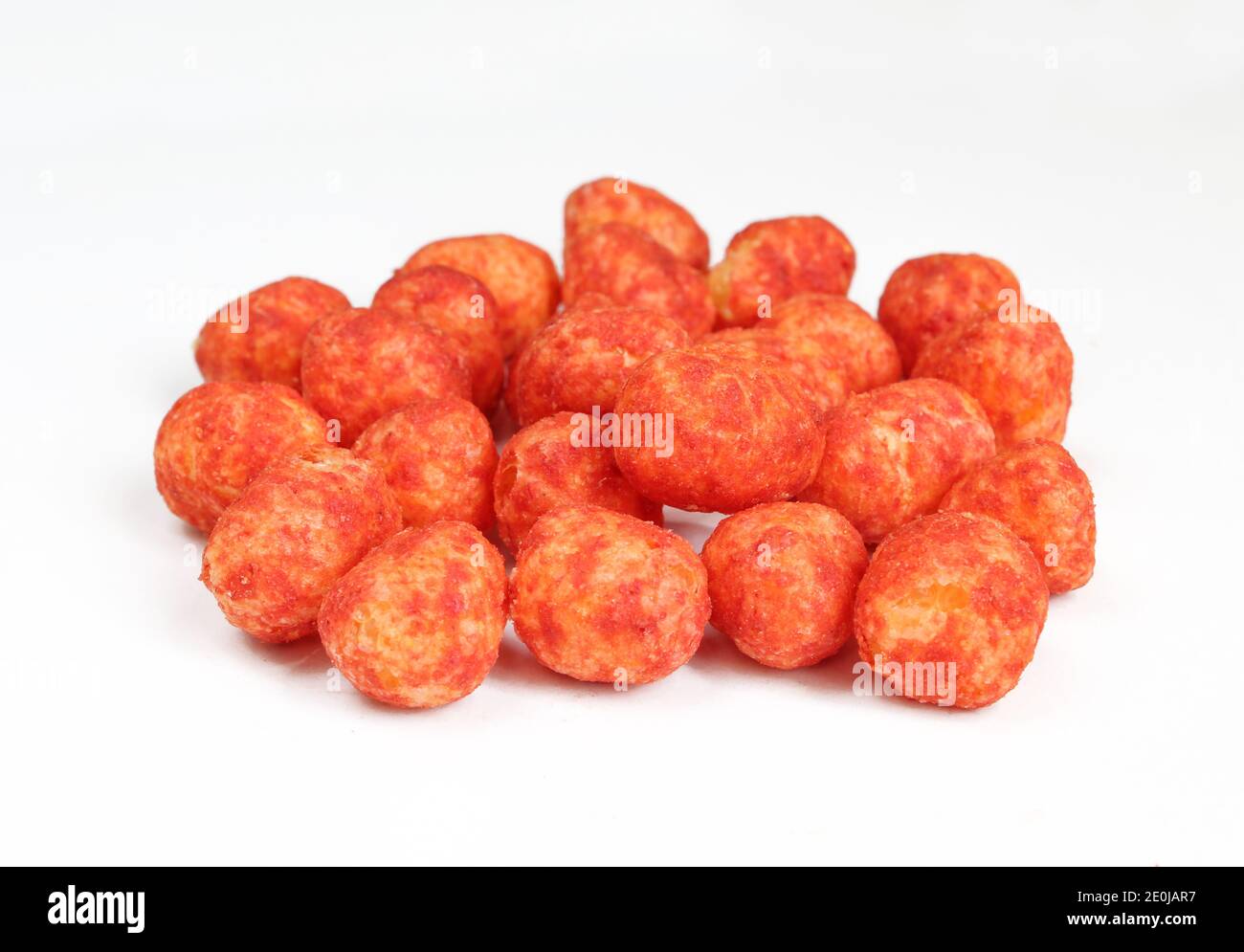 Red chili peanut puffs isolated on white background. Detailed unhealthy ...