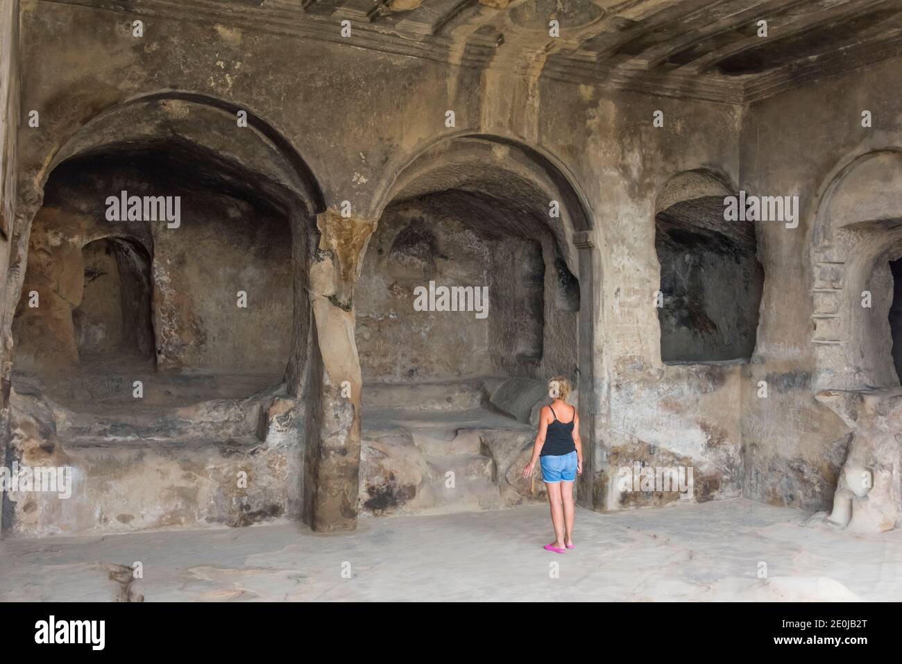Tourists at Uplistsikhe cave complex, monument of rock architecture ...