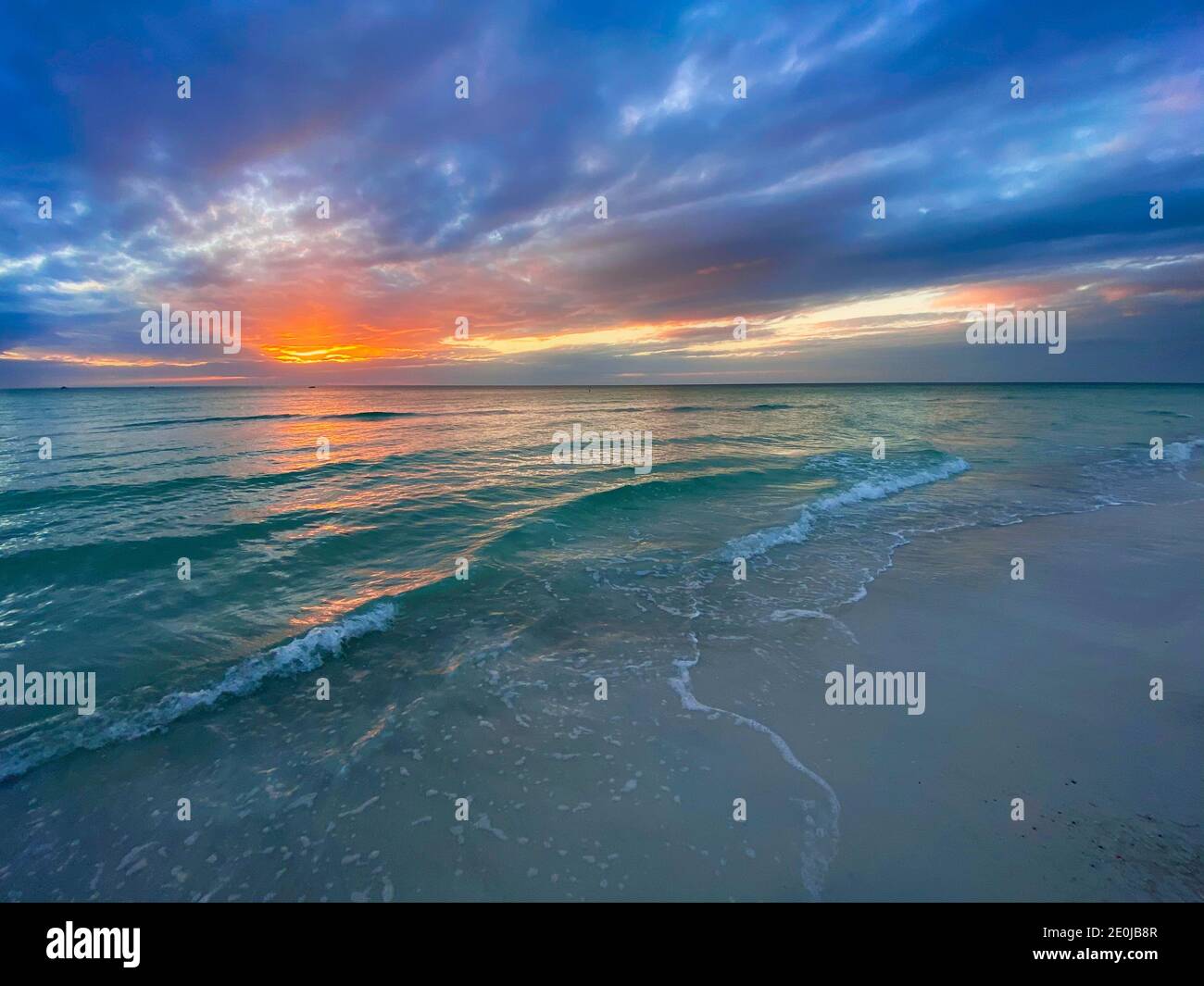 sunset on the beach Stock Photo - Alamy