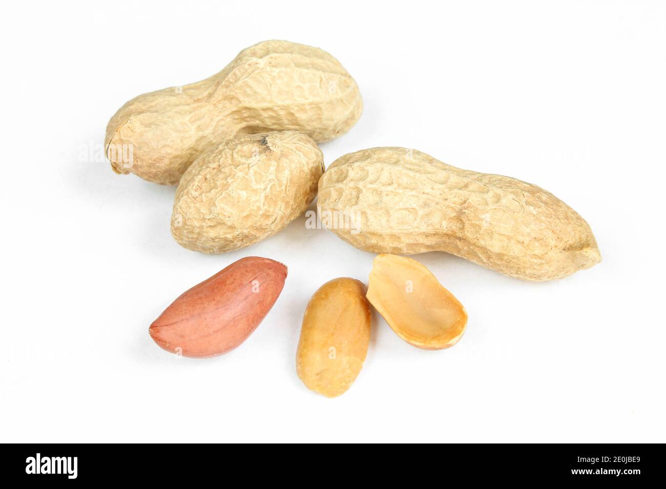 Peanuts in shell and peeled isolated on white background. Closeup and ...