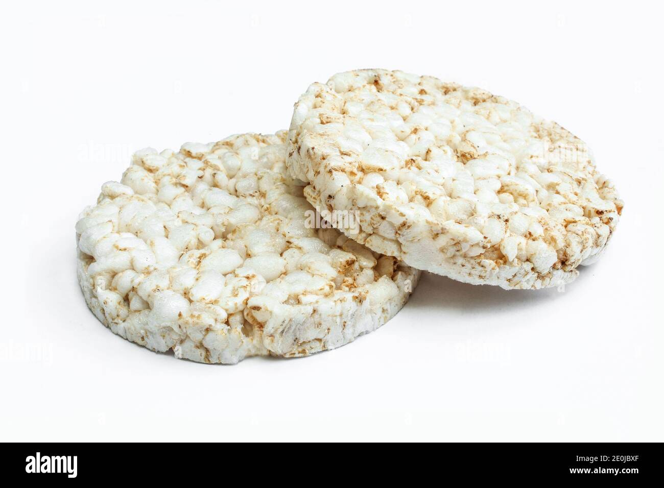 Two pieces of rice cake isolated on white. Dry dietary food Stock Photo ...