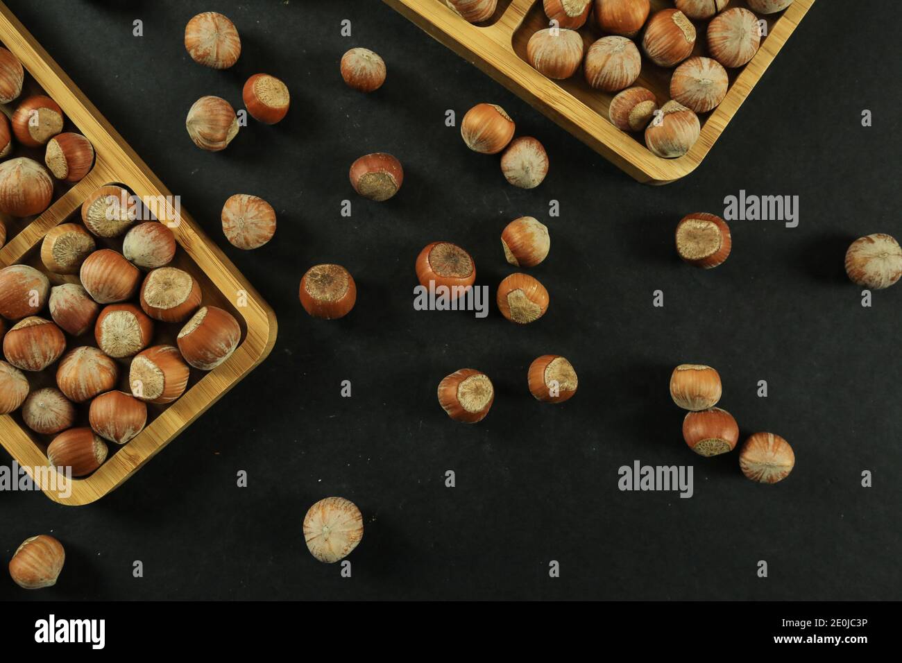 Hazelnuts on wooden backdrop. heap or stack of hazelnuts. healty food ...
