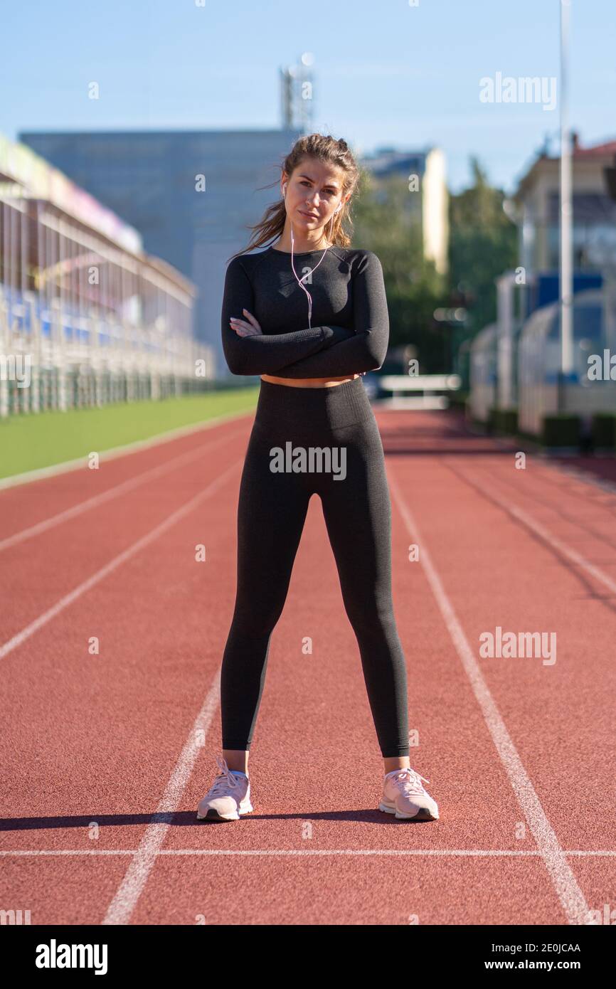 Female athlete standing stadium hi-res stock photography and images - Alamy