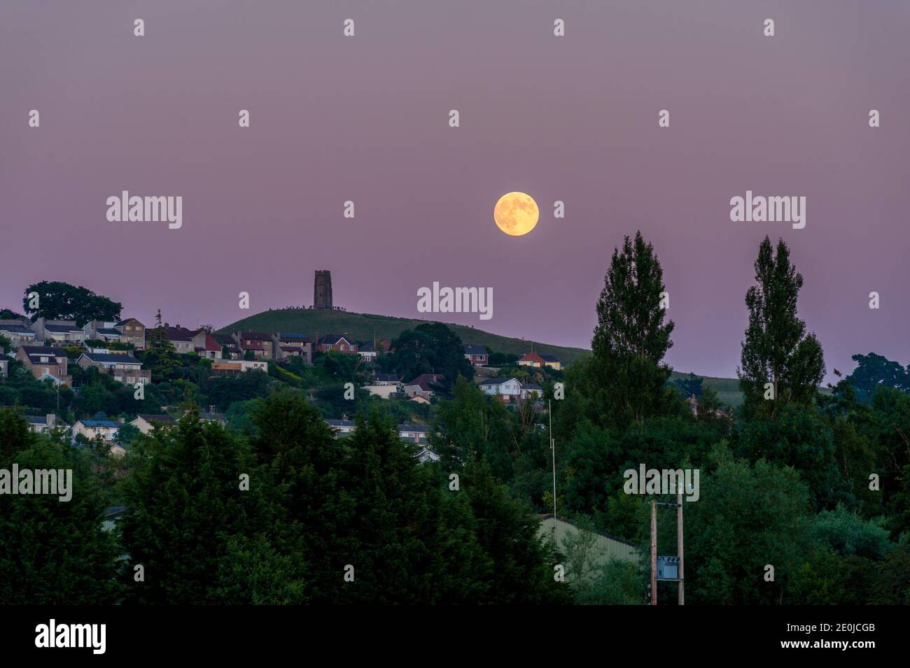 Moon rising above Glastonbury Tor from the Somerset levels Stock Photo ...