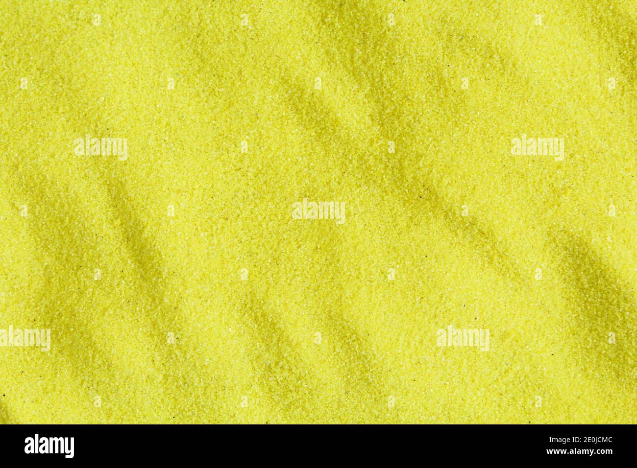 Background/texture made of decorative yellow sand crystals. Backdrop ...