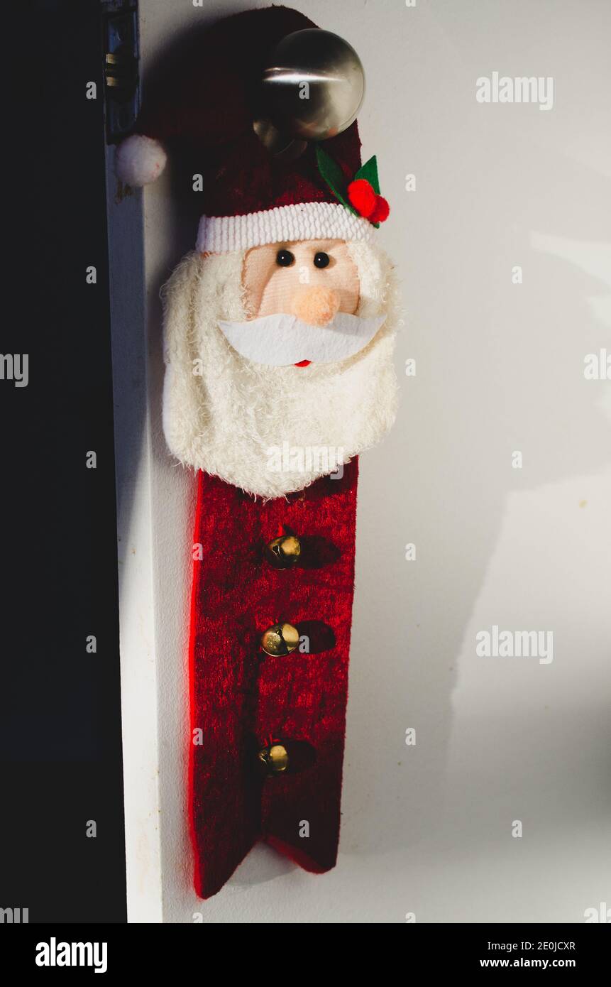 Santa Claus Christmas decoration hanging from a doorknob Stock Photo ...