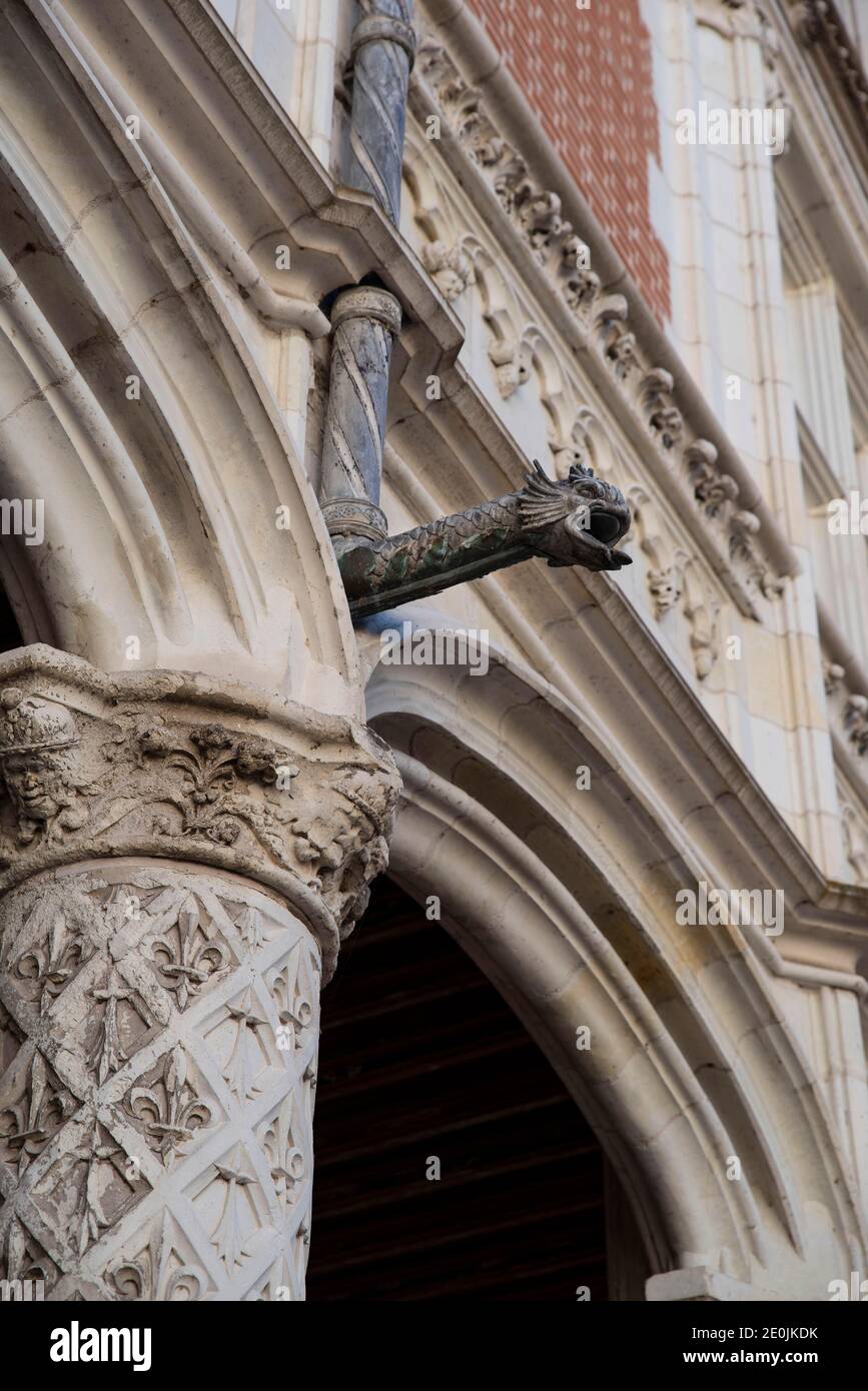 Detail of a sculpted gutter, gargoyle type, on the facade of the castle ...