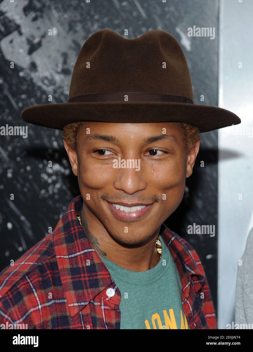 Pharrell Williams attending 'The Dark Knight Rises' premiere held at ...