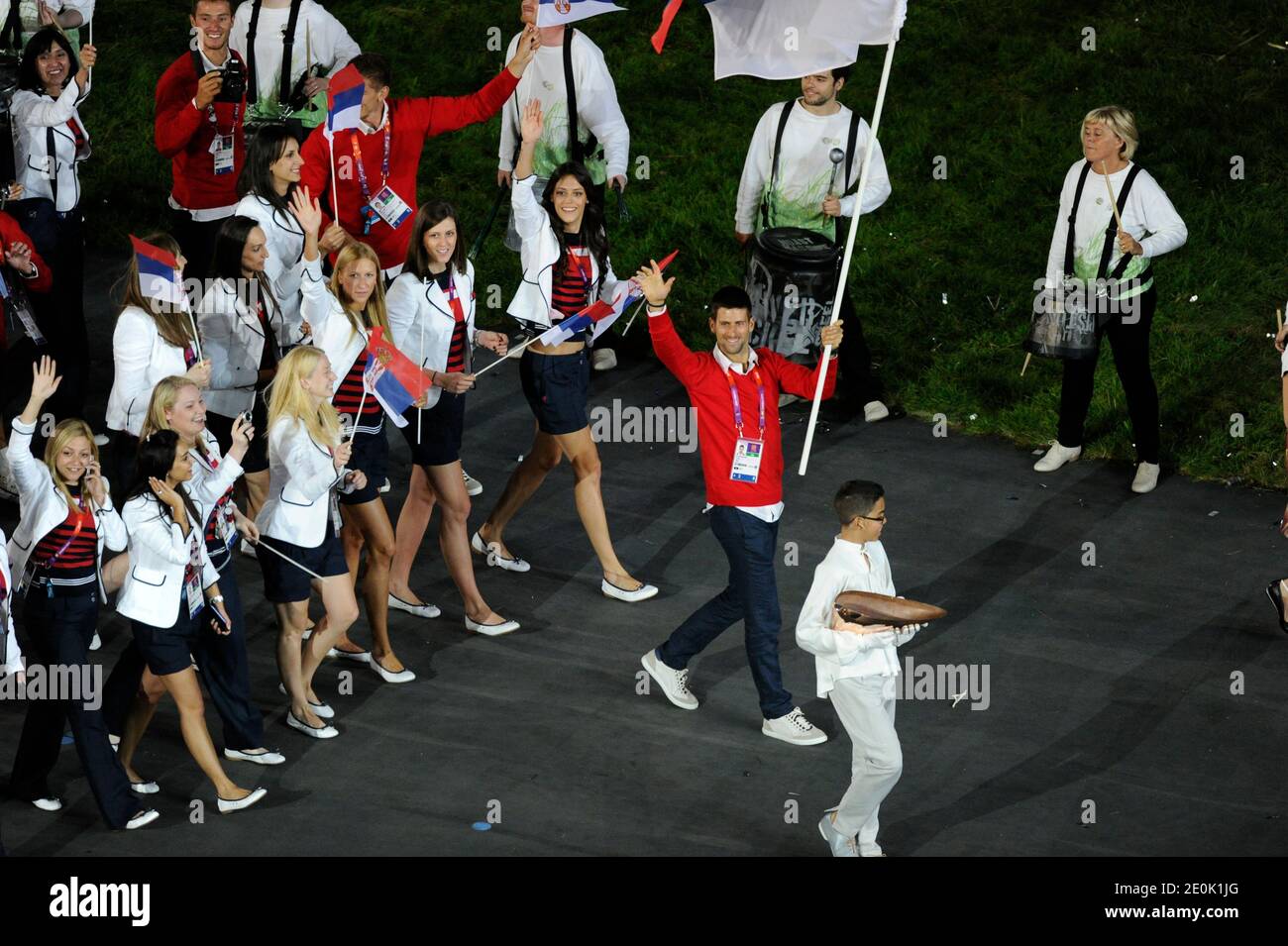 Serbia's Novak Djokovic carries her country's flag during the London ...