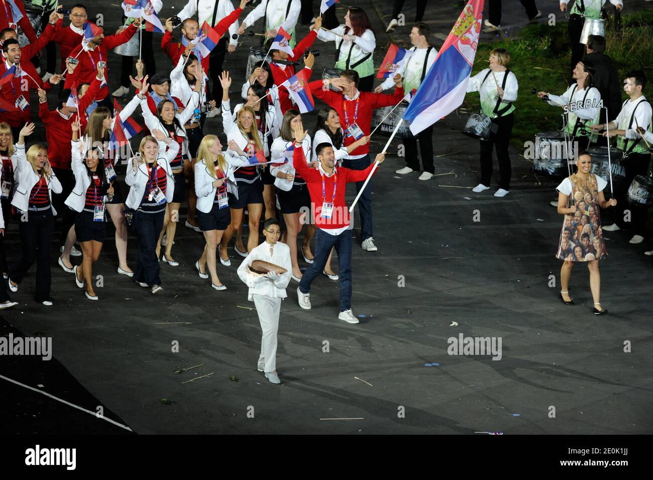Serbia's Novak Djokovic carries her country's flag during the London ...