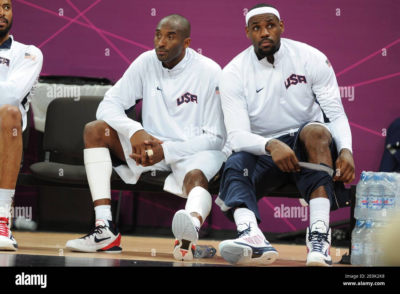 USA's Kobe Bryant (L) and LeBron James looking on the bench during ...