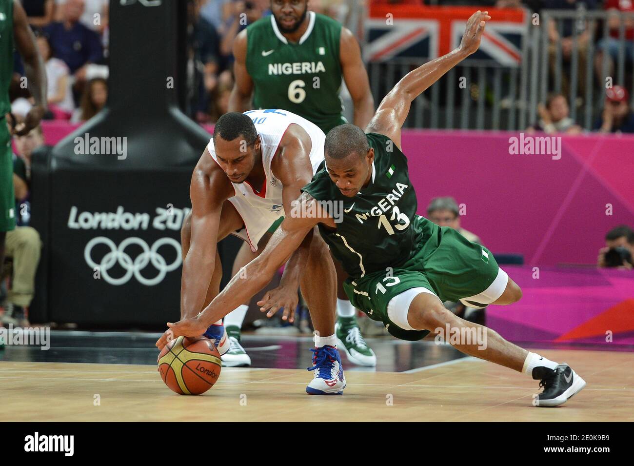Boris Diaw of France and Derrick Obasohan of Nigeria compete on Men's Basketball Preliminary ...