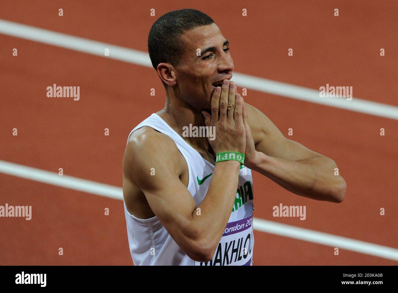 Taoufik Makhloufi of Algeria celebrates as he crosses the finish line ...