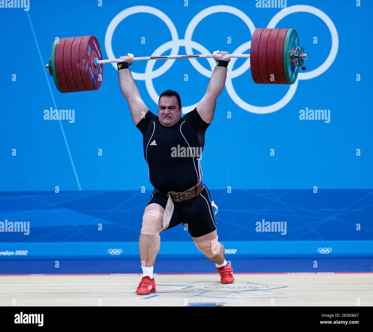 Iran's Ehsan Hadadi winner of the +105 men's weightlifting during the ...