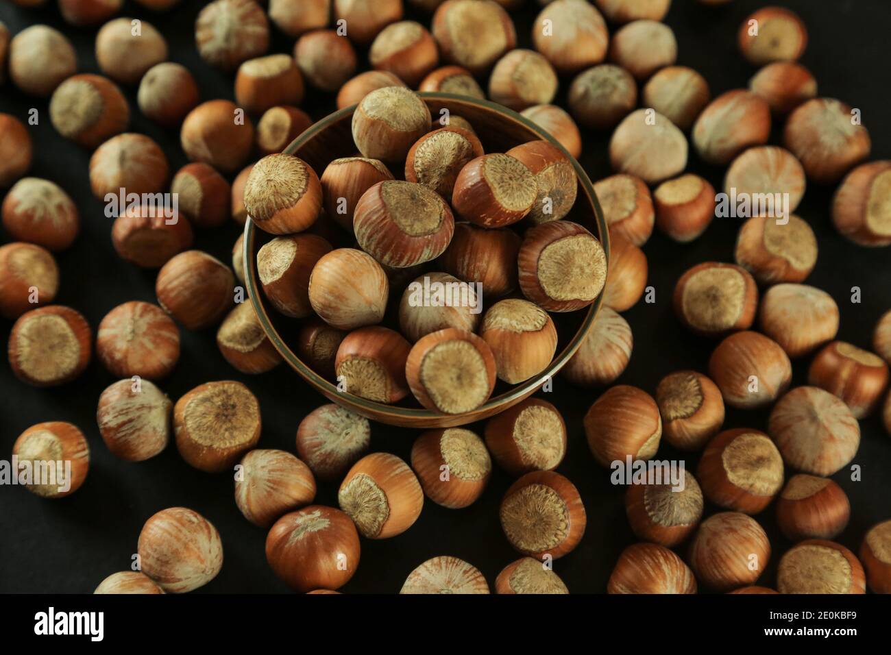 Hazelnuts on wooden backdrop. heap or stack of hazelnuts. healty food ...