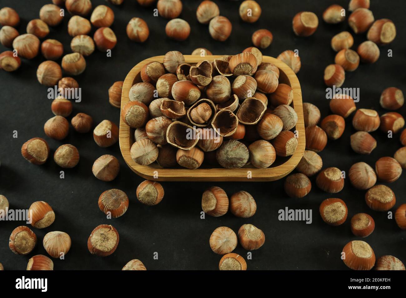 Hazelnuts on wooden backdrop. heap or stack of hazelnuts. healty food ...