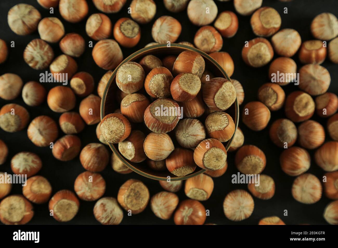 Hazelnuts on wooden backdrop. heap or stack of hazelnuts. healty food ...