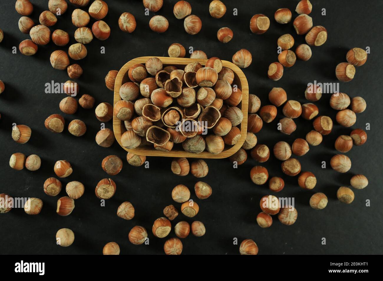 Hazelnuts on wooden backdrop. heap or stack of hazelnuts. healty food ...