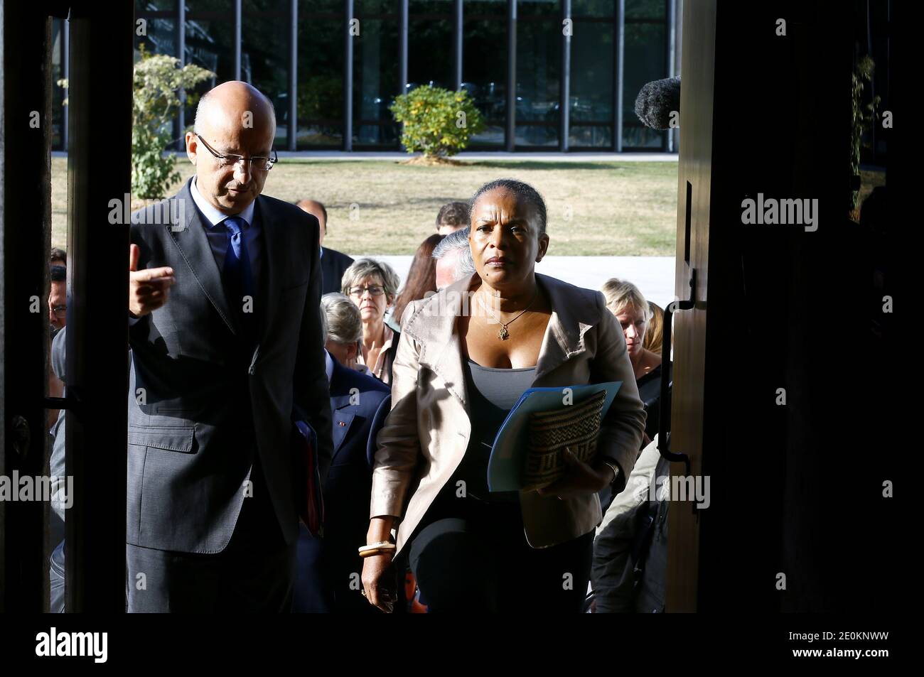 French Justice Minister Christiane Taubira flanked by Xavier Ronsin ...