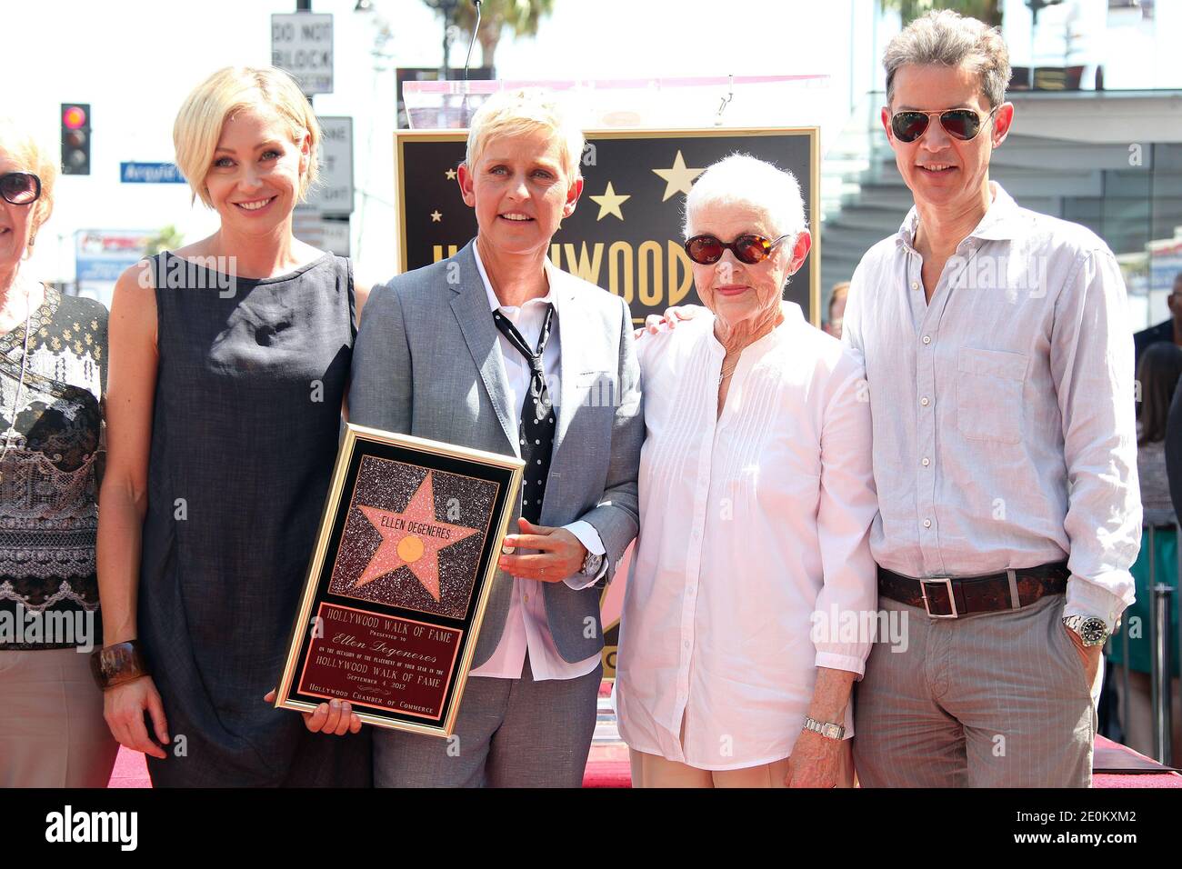 Ellen DeGeneres poses with her family as she receives a star on the ...