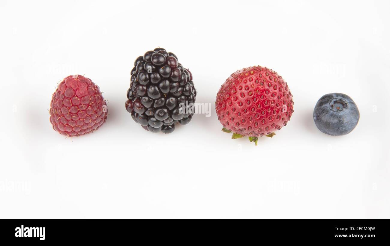 Blackberry, raspberry blueberry and strawberry on a white background ...