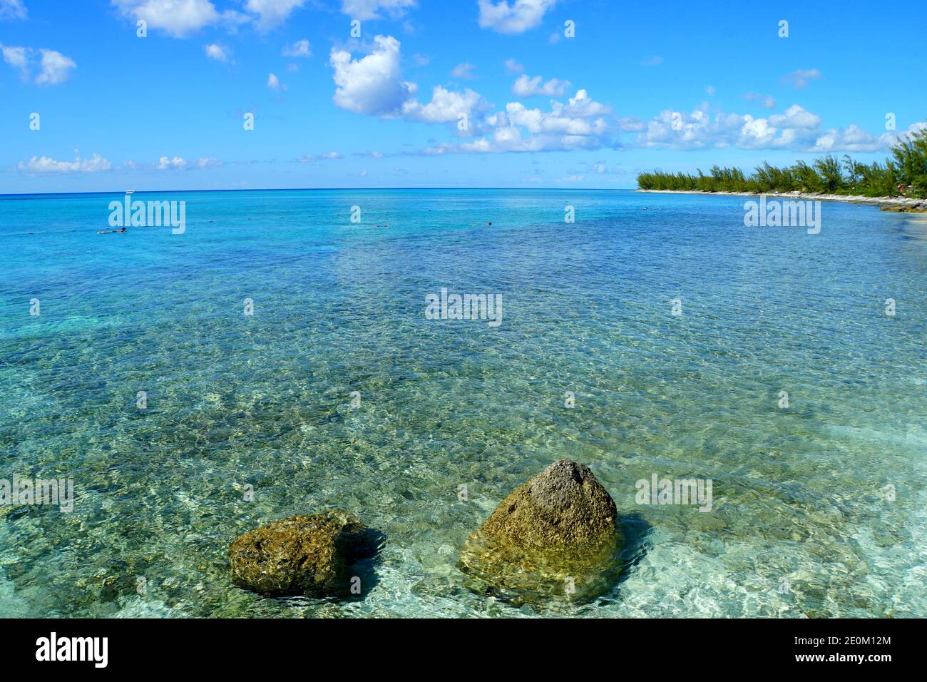 Stunning crystal clear water with corals along the shallow bay at ...