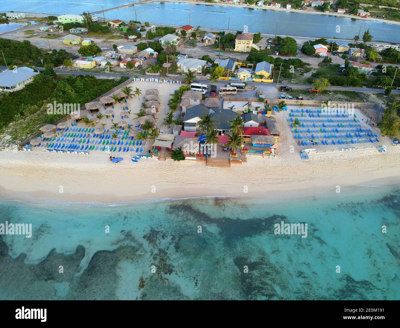 The aerial view of the resorts along the shore with private white ...
