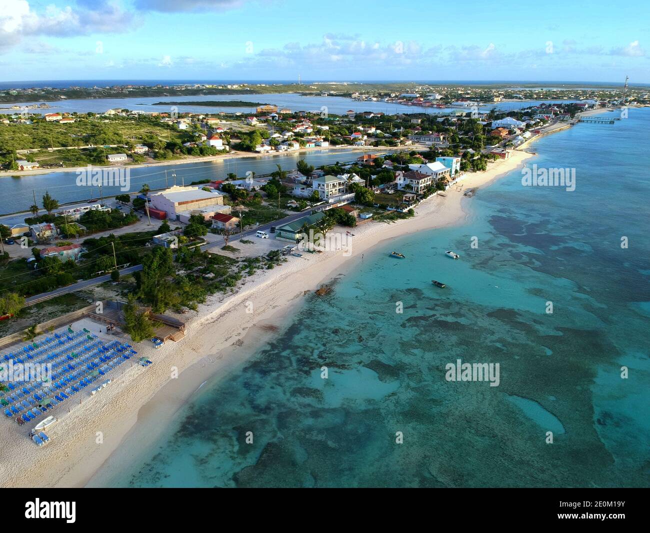 The aerial view of the resorts along the shore with private white ...