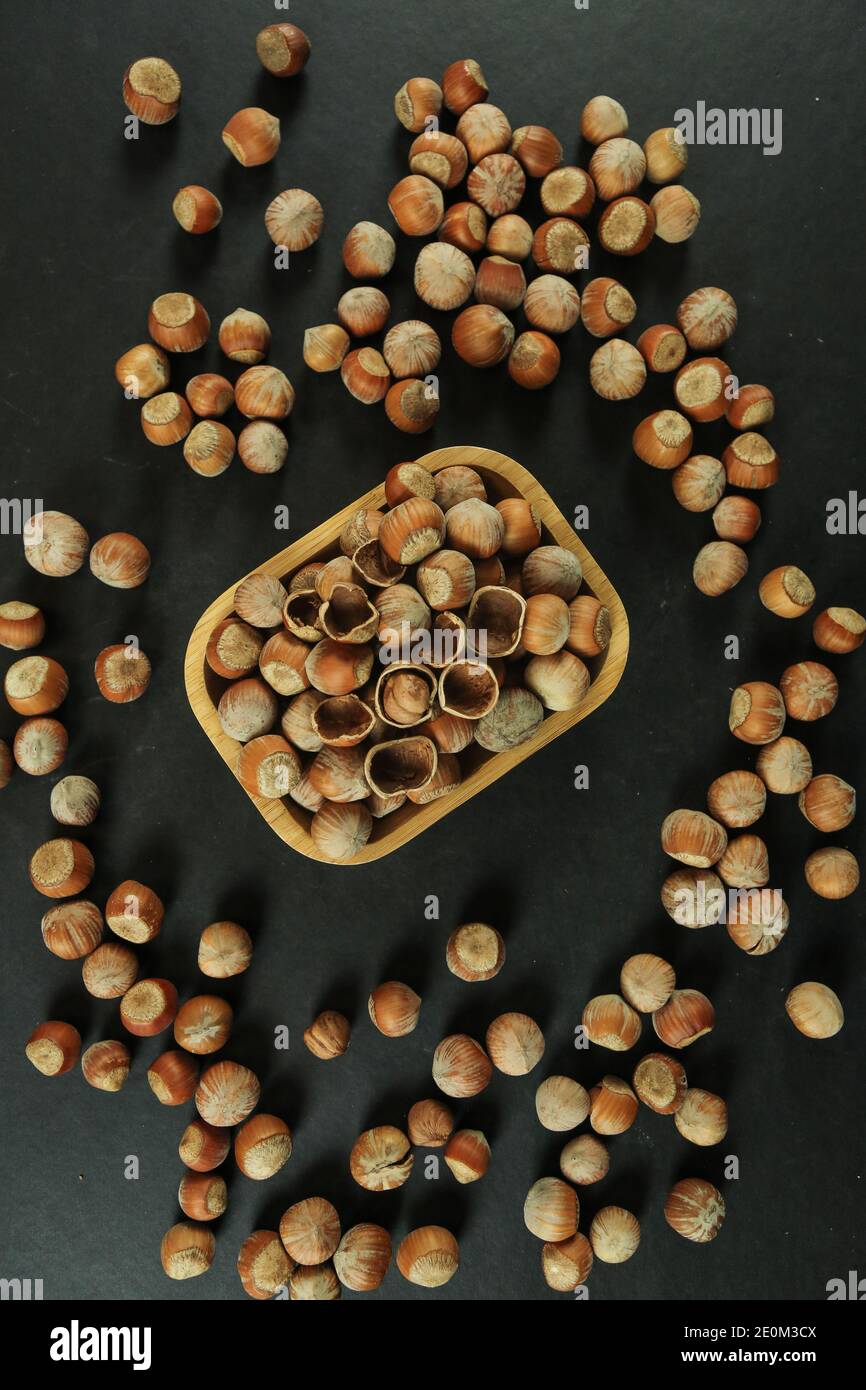 Hazelnuts on wooden backdrop. heap or stack of hazelnuts. healty food ...