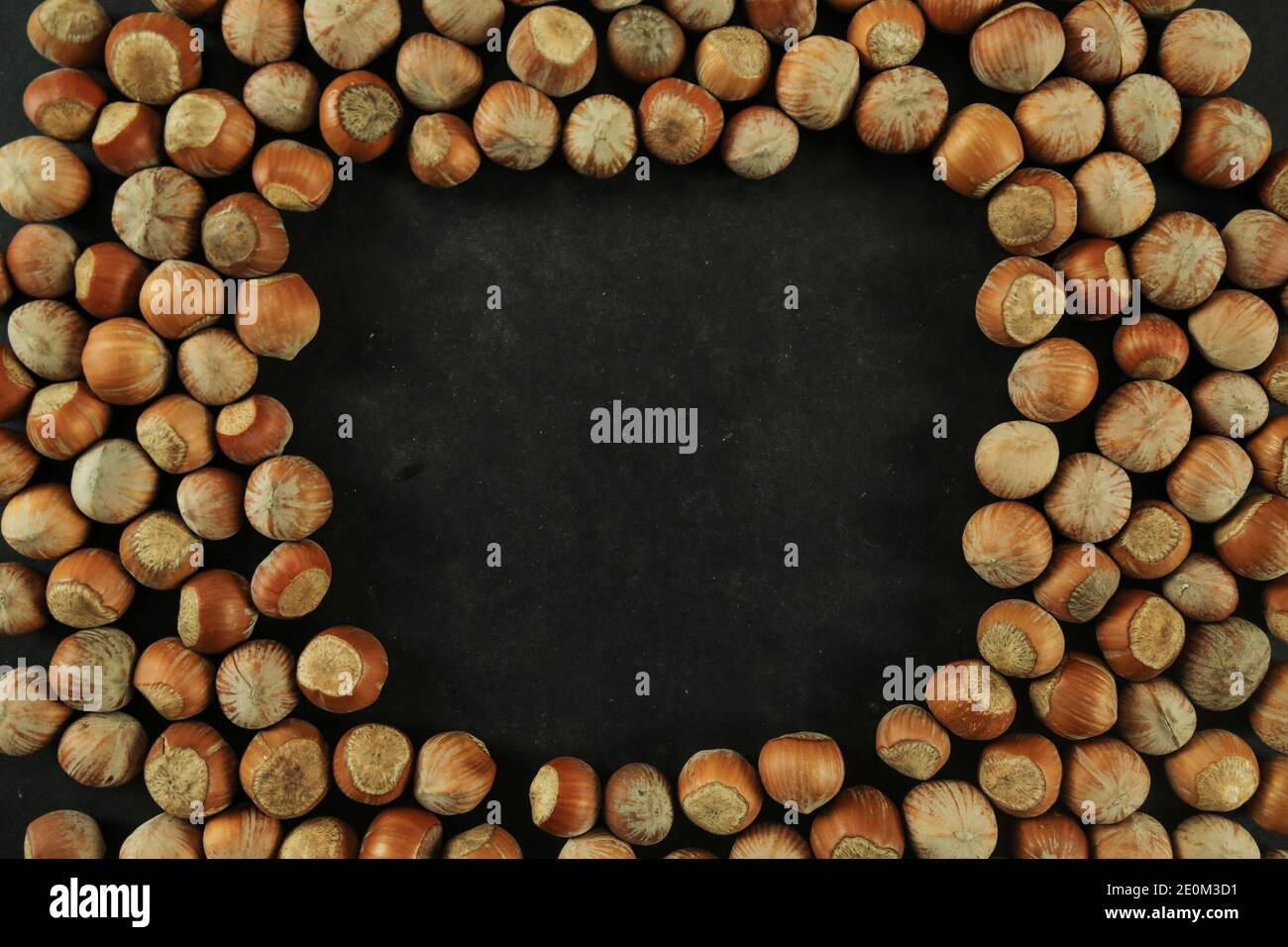 Hazelnuts on wooden backdrop. heap or stack of hazelnuts. healty food ...