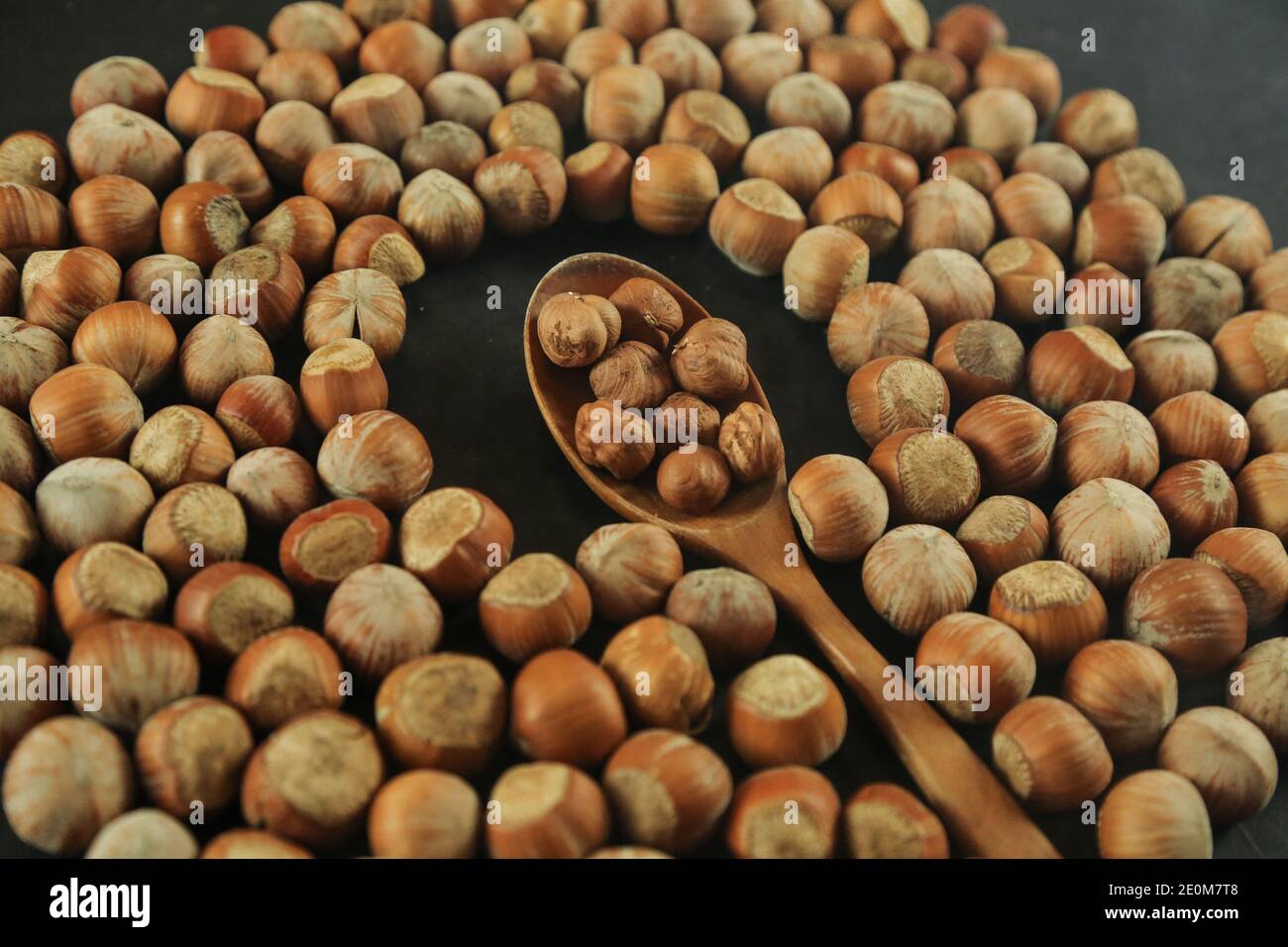 Hazelnuts on wooden backdrop. heap or stack of hazelnuts. healty food ...