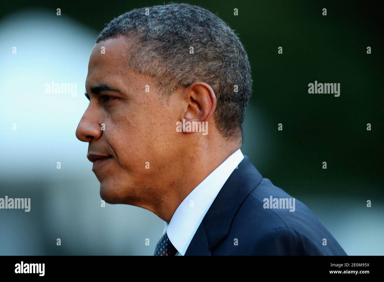 U.S. US President Barack Obama walks across the South Lawn after ...