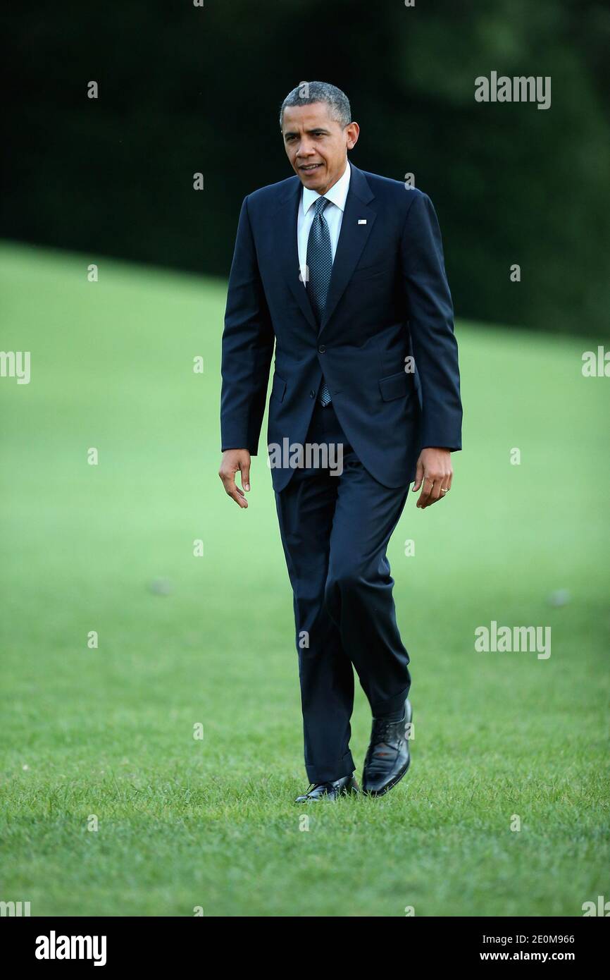 U.S. US President Barack Obama walks across the South Lawn after ...
