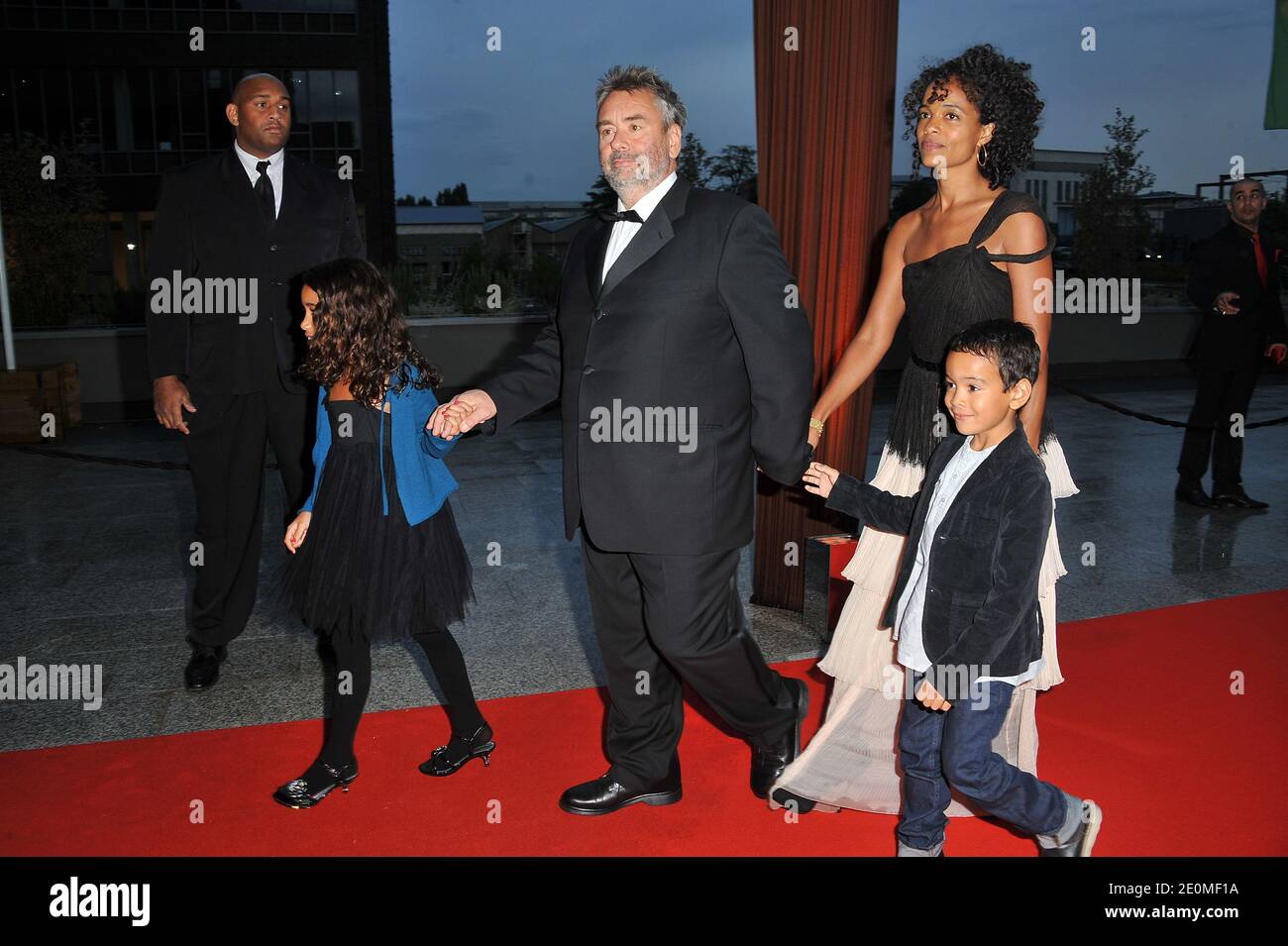 Luc Besson and his family attending 'La Cite Du Cinema' opening in ...