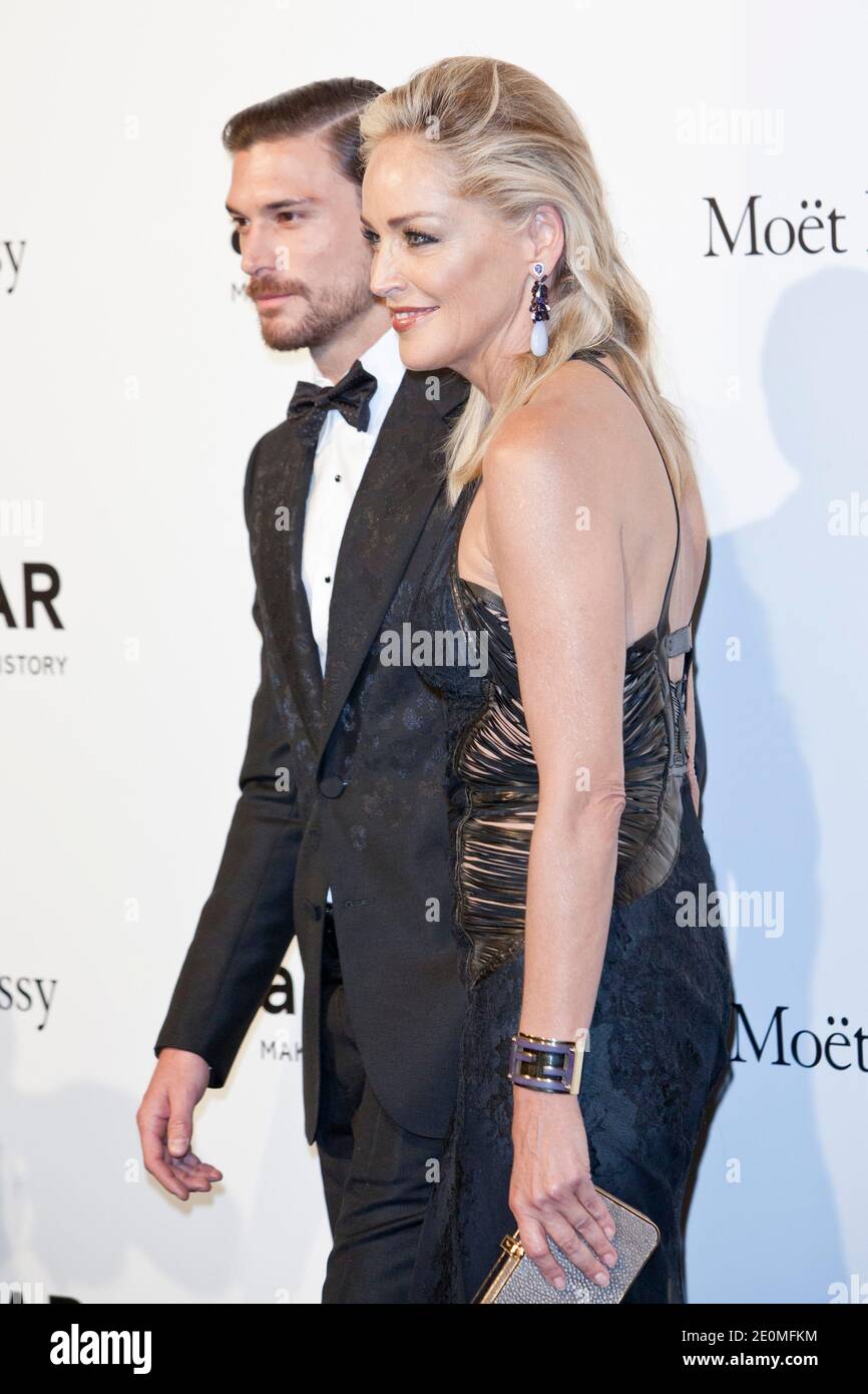 Martin Mica, Sharon Stone attending amfAR Milano 2012 during Milan ...