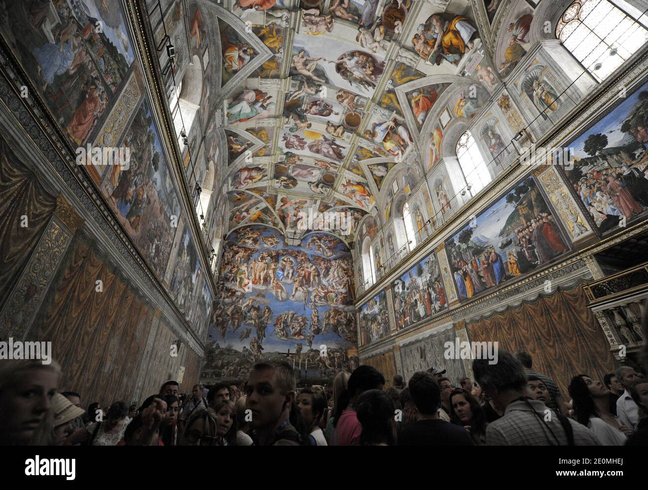Tourists in the Sistine Chapel at the Vatican on June 2010. 500 years ...