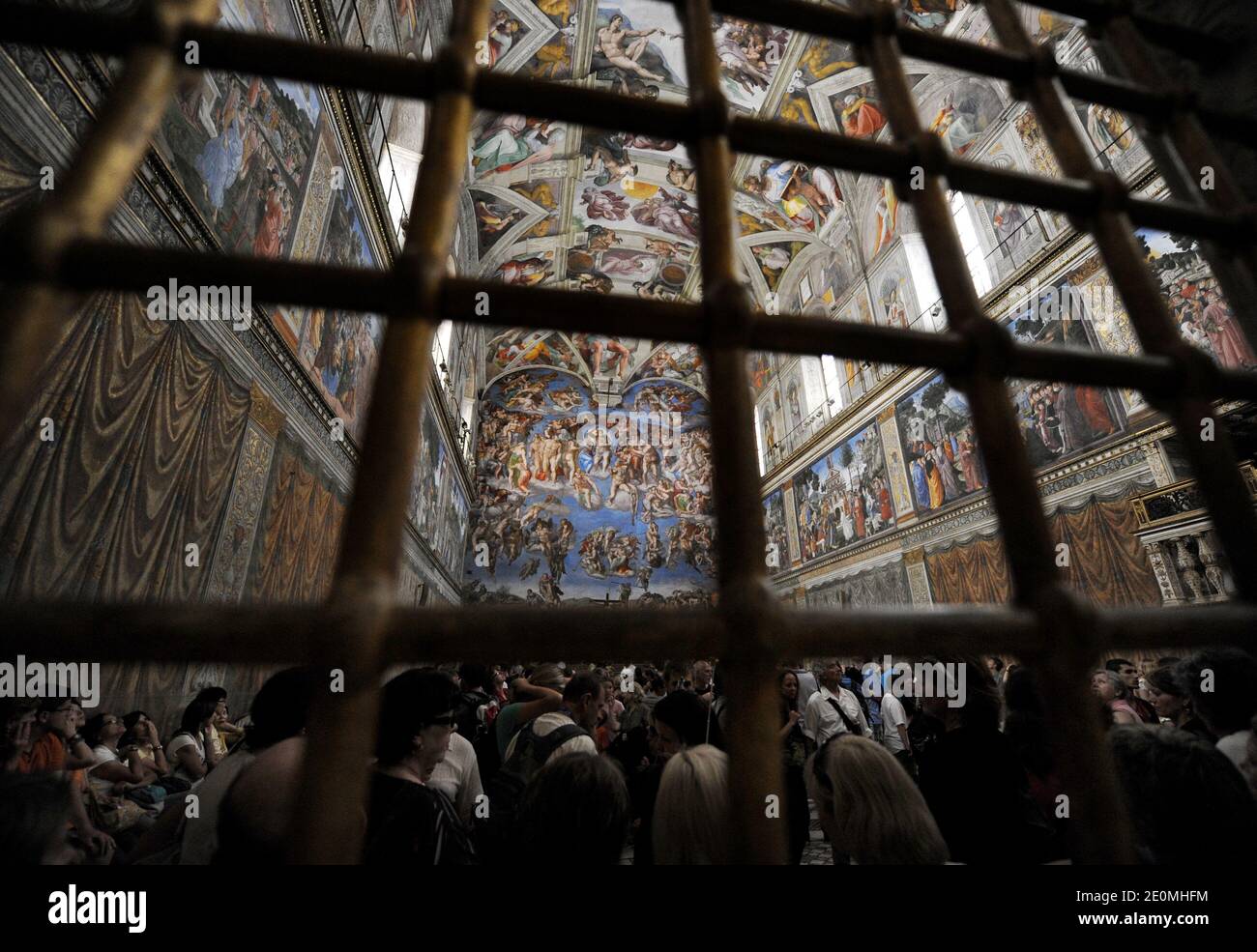 Tourists in the Sistine Chapel at the Vatican on June 2010. 500 years ...
