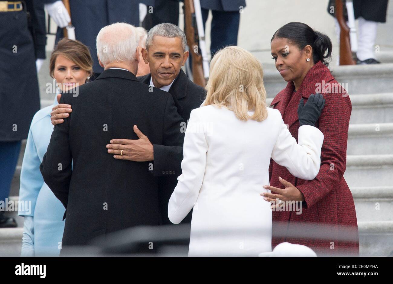 Former President Barack Obama and former First Lady Michelle Obama hug ...
