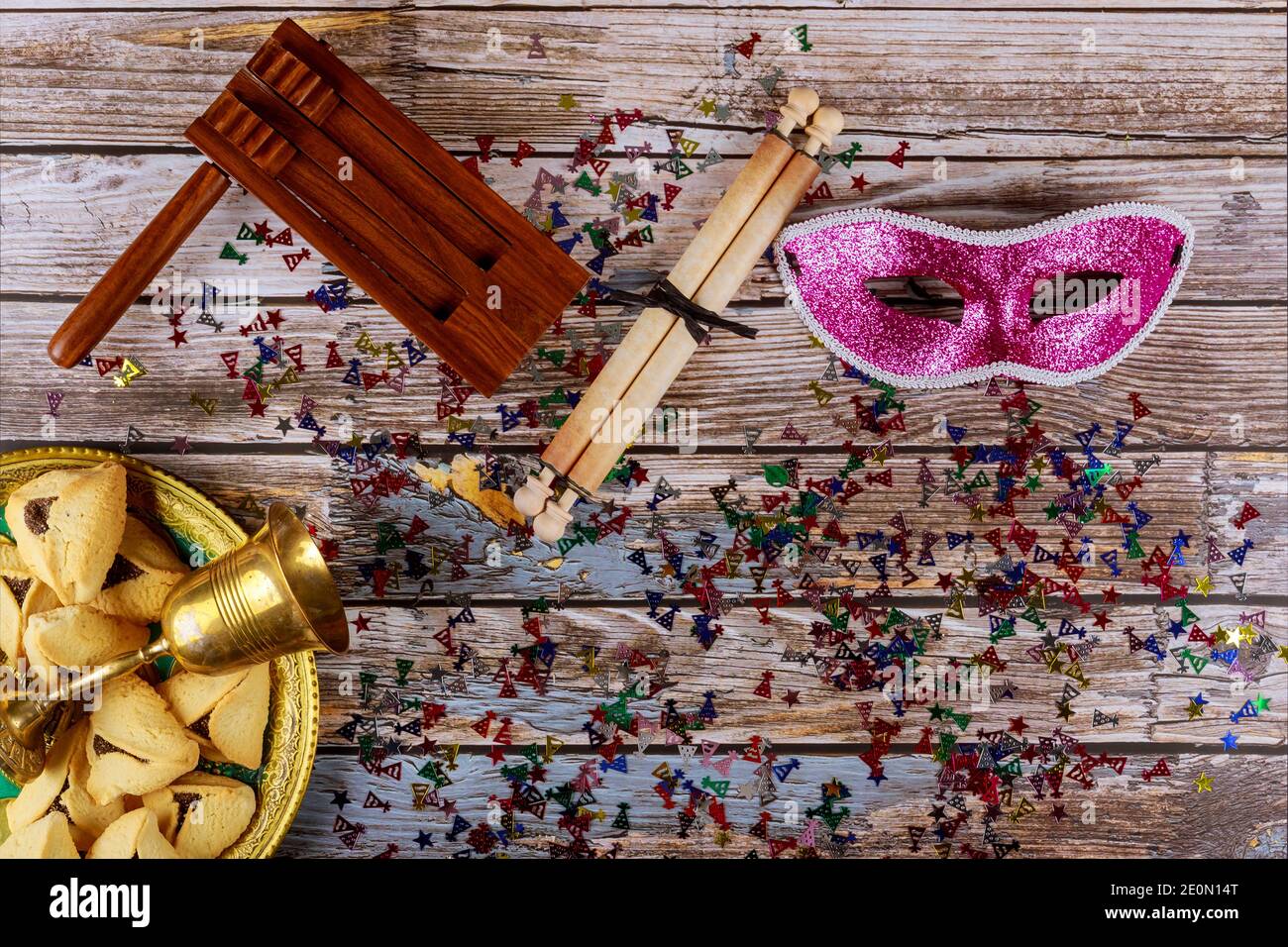 Jewish carnival Purim celebration on hamantaschen cookies, noisemaker ...