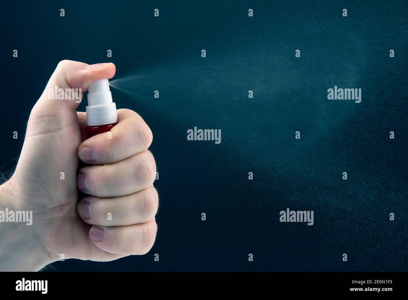 spray gun with liquid sprinkles in hand Stock Photo - Alamy