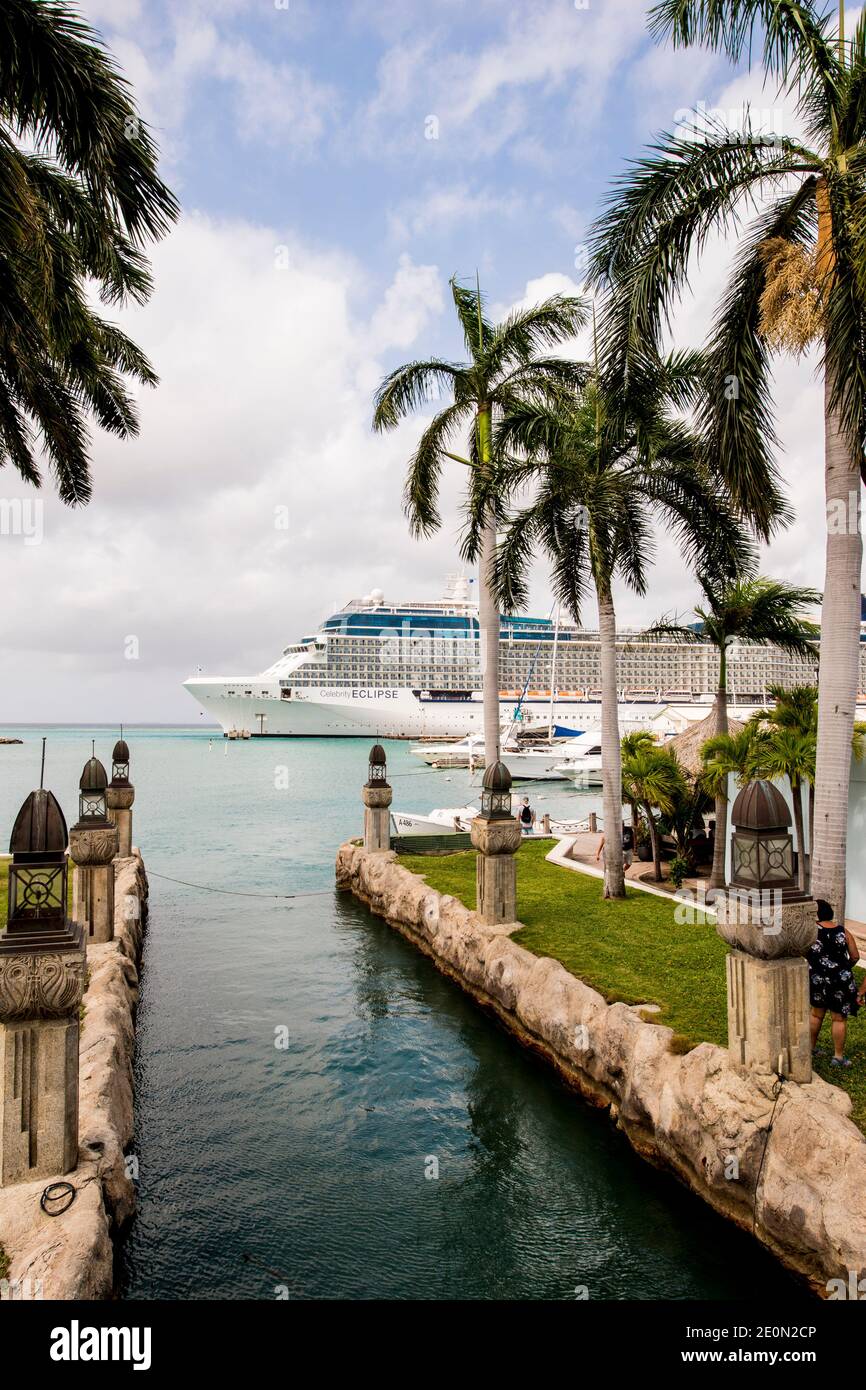 Local fishing boat and cruise ship in port, Oranjestad, Aruba Stock ...