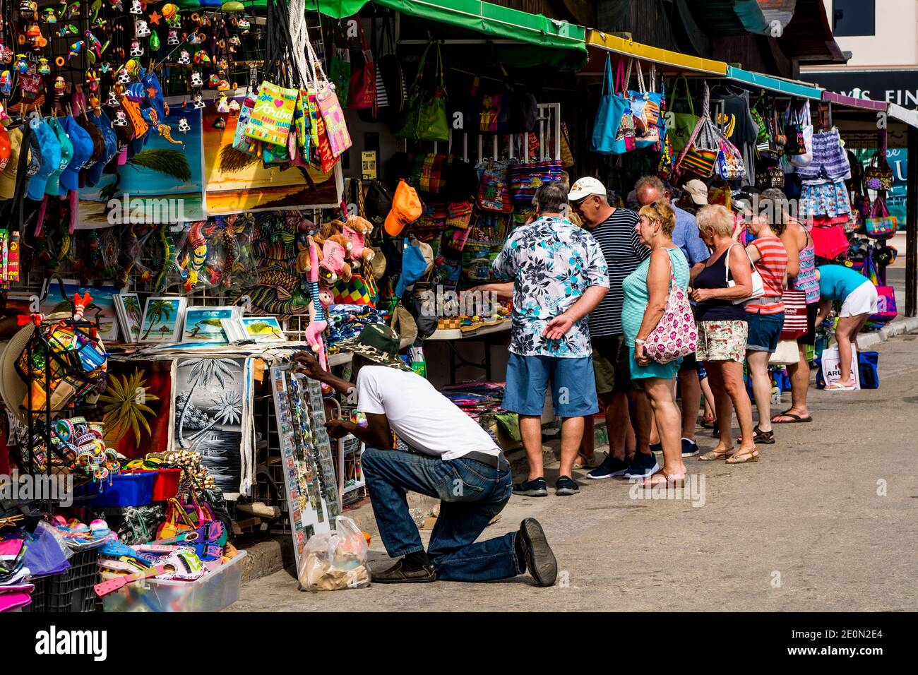 Tourists cruise passengers shopping in the local market in Oranjestad ...